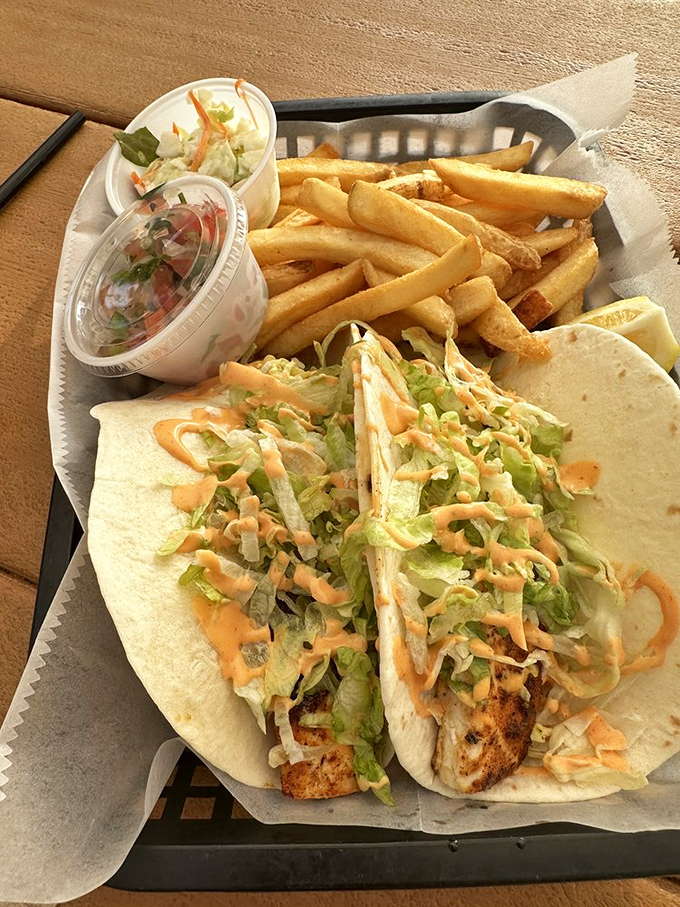 Lunch is served! Dive into these fresh, flavorful fish tacos with a side of crispy fries&mdash;a Boondocks Port Orange favorite.