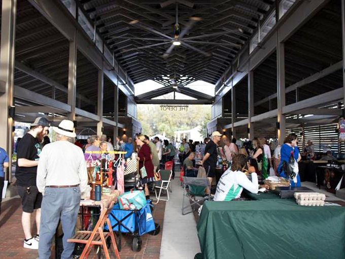 The Depot's interior hums with activity, a human beehive of commerce and conversation under the soaring industrial ceiling.