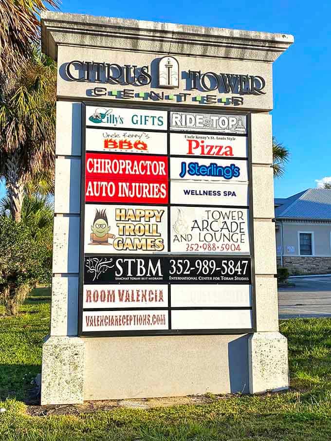 Tower Business Directory: The sign reveals the tower's evolution into a multi-purpose landmark, housing businesses that give this historic structure continued relevance in modern Clermont.