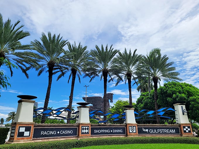 Gulfstream Park's welcoming sign hints at the wonders beyond – where racing tradition meets mythological spectacle in true Florida fashion.