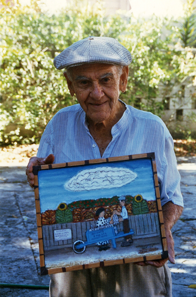 The master himself &ndash; Mario Sanchez holds one of his beloved carvings, his face reflecting the same warmth and character found in his artwork.
