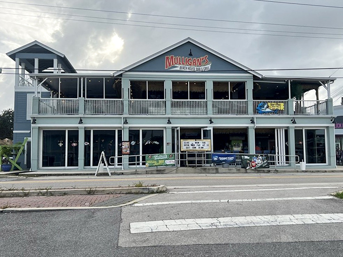 The blue-hued exterior with wraparound deck looks like it was plucked from a coastal postcard and planted right on Main Street.