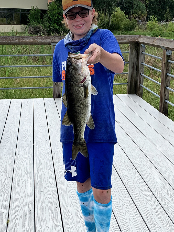 That proud smile says it all – at Cooter Pond, fishing isn't just a hobby, it's a victory worth celebrating.