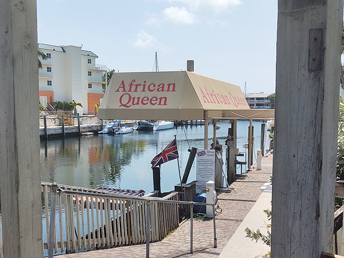 The African Queen's distinctive signage welcomes visitors to step aboard and experience a genuine piece of Hollywood history in person.