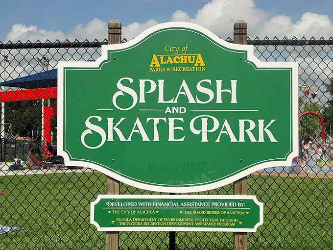 The official sign welcomes visitors to Alachua's Splash and Skate Park, a testament to community planning that understands what families truly need.