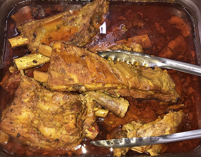 Slow-braised lamb that falls apart at the mere suggestion of a fork, swimming in a sauce worth bottling and taking home.