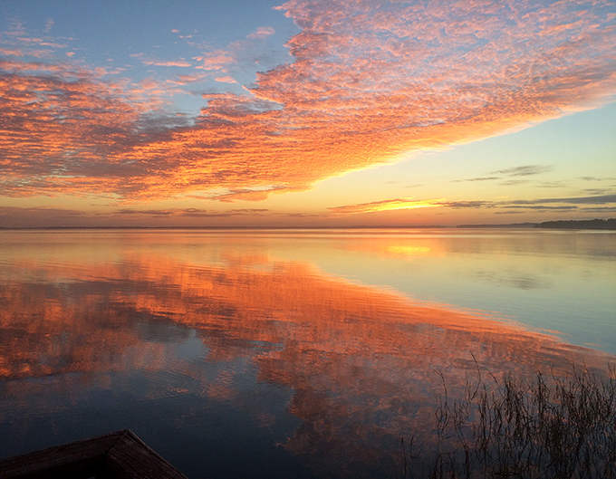 A Lake Harris sunset doesn't just end the day &ndash; it celebrates it with a technicolor finale that makes you grateful for eyesight.