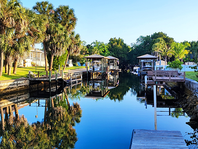 Crystal River's waterways create a mirror-like reflection of waterfront homes and boat docks, a peaceful haven where manatees gather during winter months.