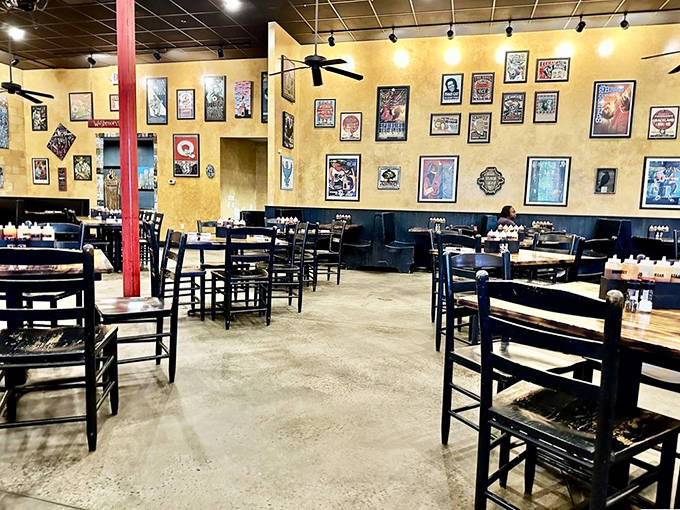MOJO Kitchen's dining room welcomes BBQ lovers with yellow walls covered in music posters, creating the perfect backdrop for serious meat enjoyment.
