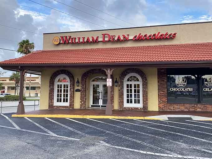 William Dean Chocolates welcomes you with charming brick arches and classic storefront appeal that promises sweet treasures inside.
