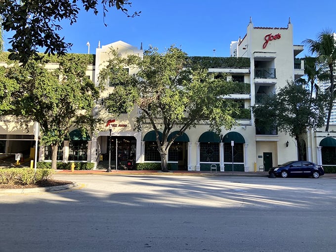 Daytime reveals Joe's classic white architecture, where patient diners have waited for the perfect stone crab experience since long before Instagram food pics existed.