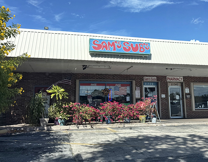 The iconic red "Sam's Subs" sign stands out against the Florida sky. This local gem has been satisfying Port Charlotte's sandwich cravings for years.