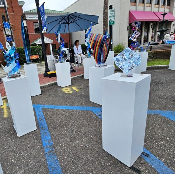 Gleaming glass sculptures catch the light like captured ocean waves, each piece telling a story of artistic vision and meticulous craftsmanship.