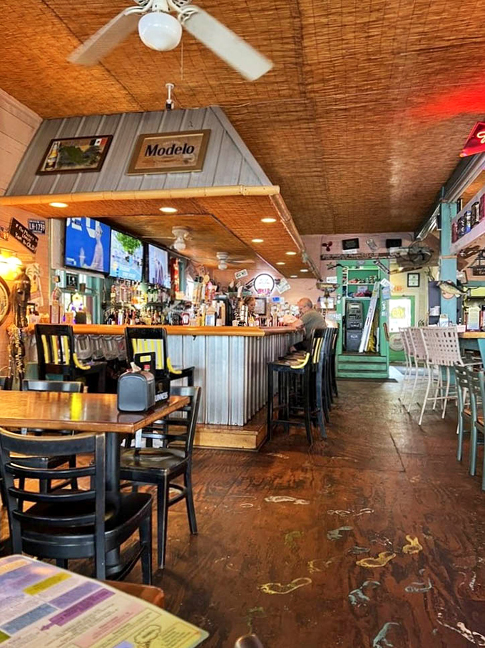 Step inside to a bamboo ceiling paradise where corrugated metal meets wooden charm &ndash; like Florida's coolest living room with a fully stocked bar.
