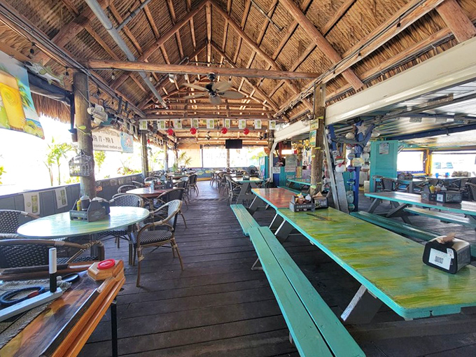 Step inside to discover a rustic paradise where wooden beams frame open-air dining spaces, inviting ocean breezes to join you for lunch.