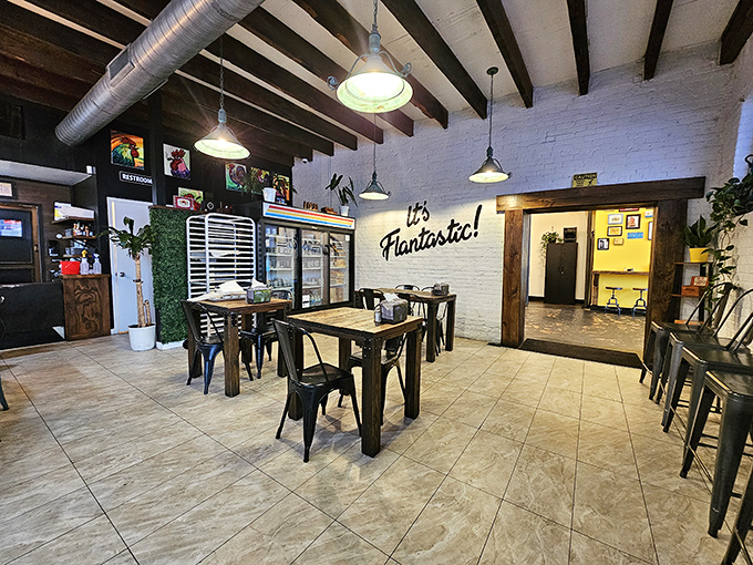 Step inside to exposed beams, industrial lighting, and that "It's Flantastic!" wall declaration that isn't just clever wordplay&mdash;it's a promise kept.