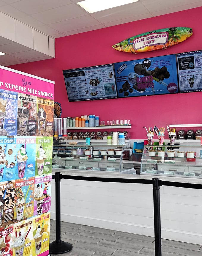 Inside, the vibrant pink walls and surfboard decor create the perfect backdrop for ice cream adventures – beach vibes without the sand in your shoes.
