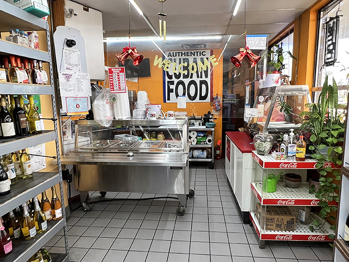 Inside, the compact space is all business – shelves of Cuban staples and a service counter where sandwich magic happens daily.