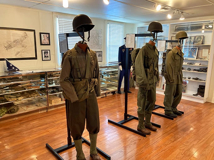Inside, mannequins model vintage military uniforms with more dignity than most of us showed in our yearbook photos, standing eternal watch over the artifacts surrounding them.