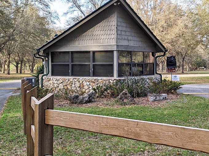 The rustic charm of the main entrance building welcomes adventurers with its stone foundation and wooden architecture.
