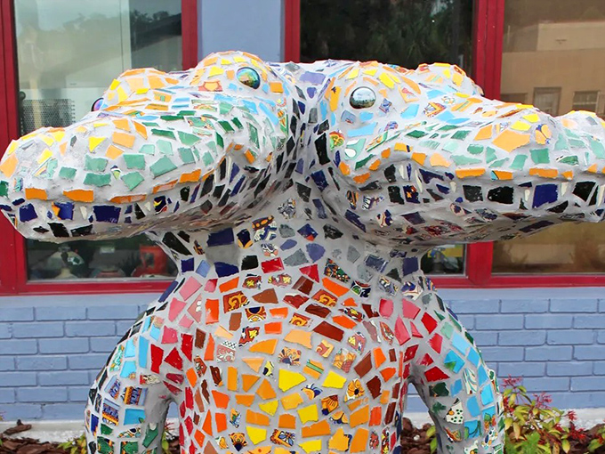 Up close and personal with those hypnotic eyes &ndash; this mosaic masterpiece uses hundreds of colorful tiles to create Florida's favorite mythical reptile.