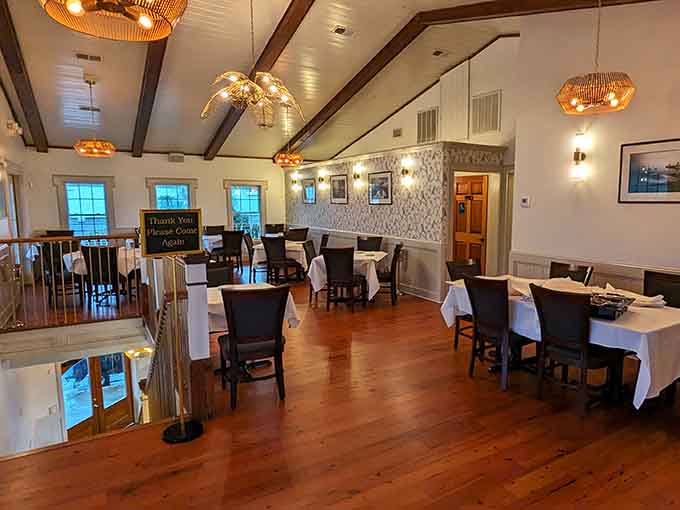 Inside, the dining room balances elegance with comfort, where white tablecloths meet warm wood and nobody judges your appetite.