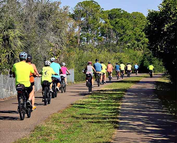Group rides transform the trail into a colorful parade of helmets, jerseys, and the universal language of cyclists: heavy breathing and occasional grunts.