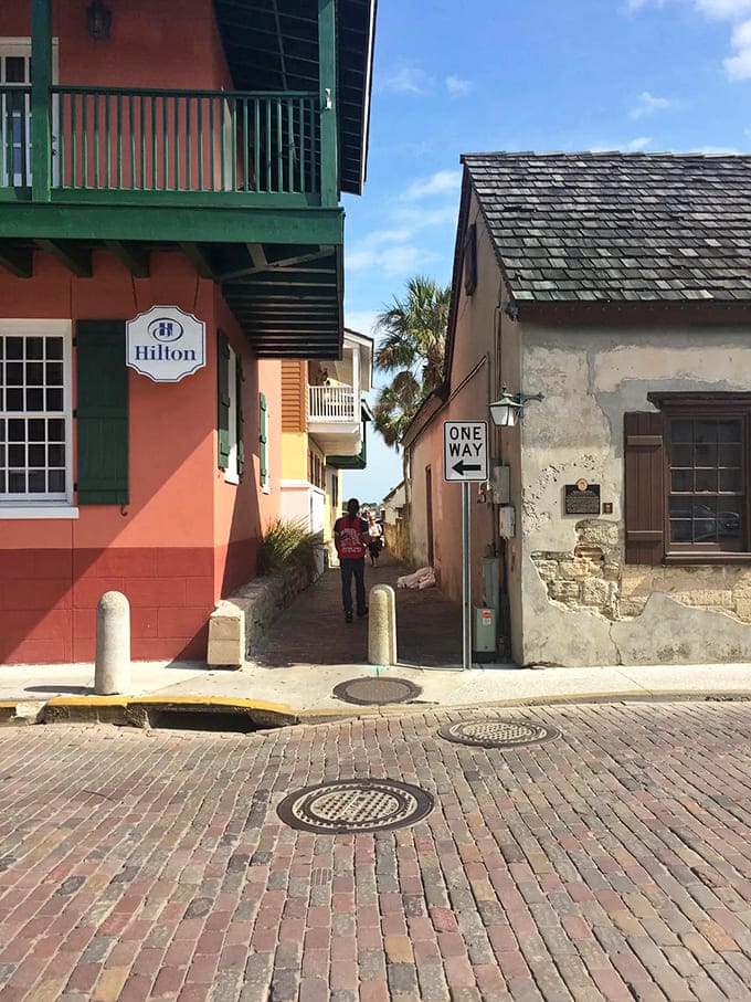 The eastern entrance welcomes explorers into America's skinniest street, where coquina walls have been keeping secrets since the 1600s.