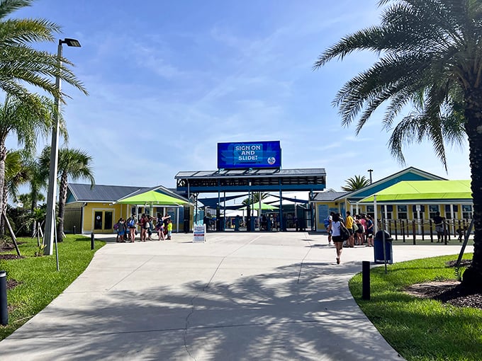 The welcoming entrance beckons visitors with its cheerful tropical vibe, promising a day where "adulting" can be temporarily suspended.