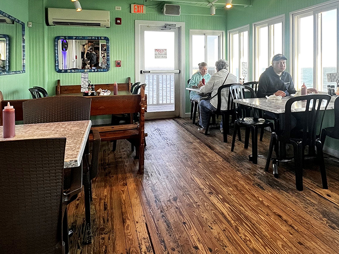 Mint green walls and weathered wood floors create the perfect backdrop for seafood feasts with panoramic water views.