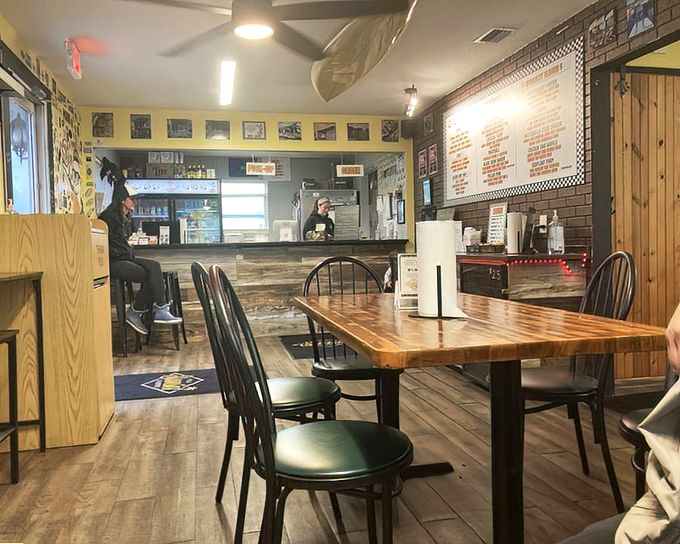 Yellow walls and wooden tables create that perfect "come as you are" vibe where comfort meets culinary creativity.