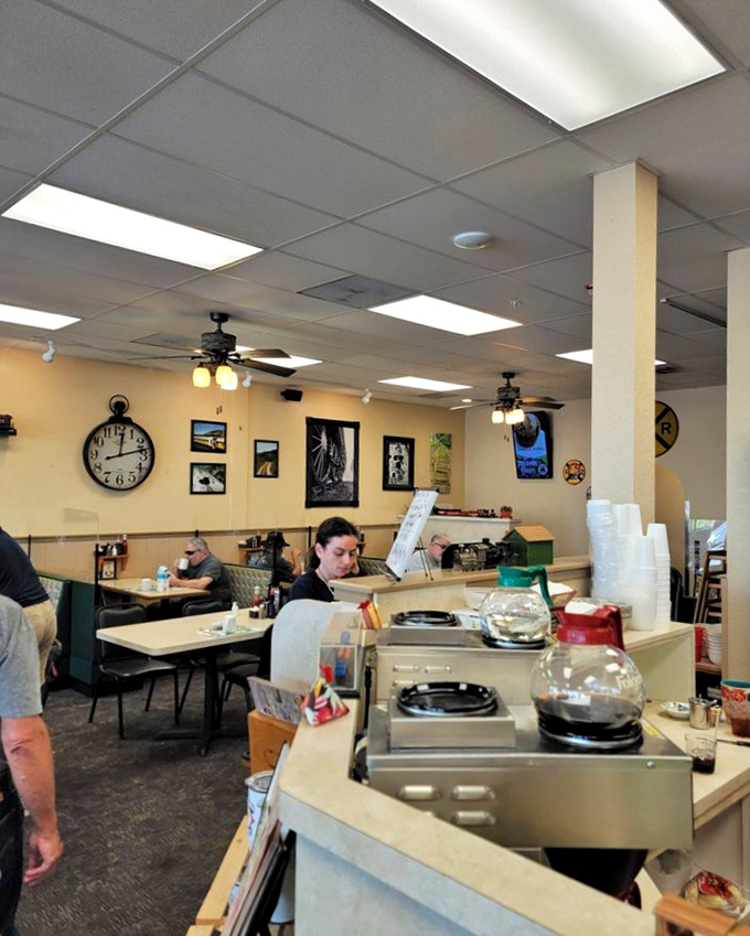 Inside, yellow walls and casual seating create that "everybody knows your name" vibe where coffee refills flow as freely as the conversation.