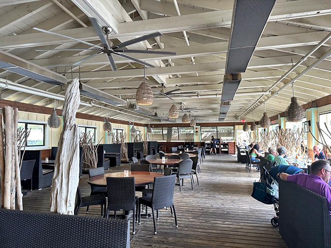 Rustic elegance meets coastal charm in Cap's airy dining room, where every seat feels like the captain's table.