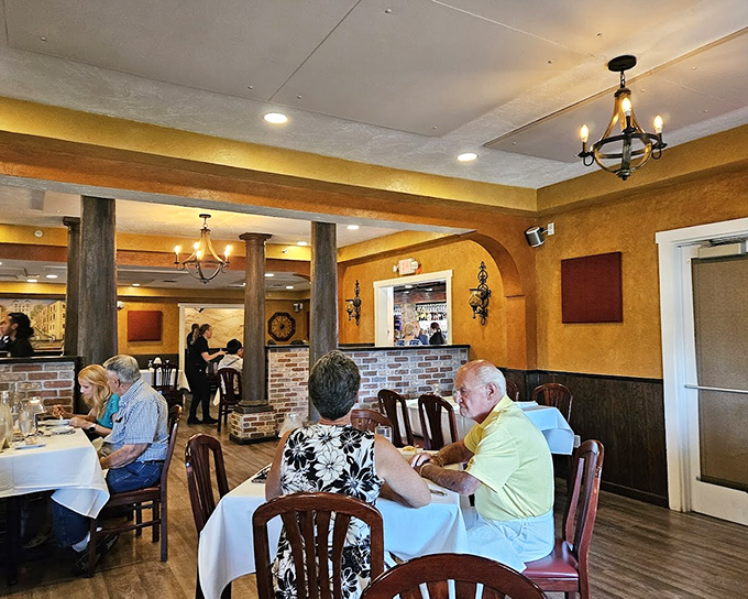 Ochre walls and intimate tables create that perfect "nonna's dining room" atmosphere where conversations flow as smoothly as the wine.