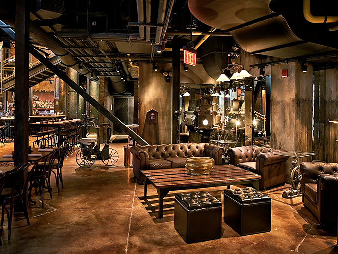 Step inside and discover a steampunk wonderland where massive gears, copper pipes, and leather seating create an atmosphere of vintage industrial luxury.
