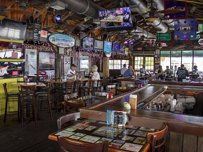 Inside, dollar bills and fishing memorabilia create the perfect backdrop for cold drinks and warm conversations &ndash; Florida's version of a living room.