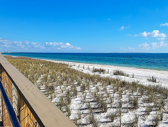 Crystal clear waters stretch to the horizon, where the sky meets the Gulf in a seamless embrace of blues.