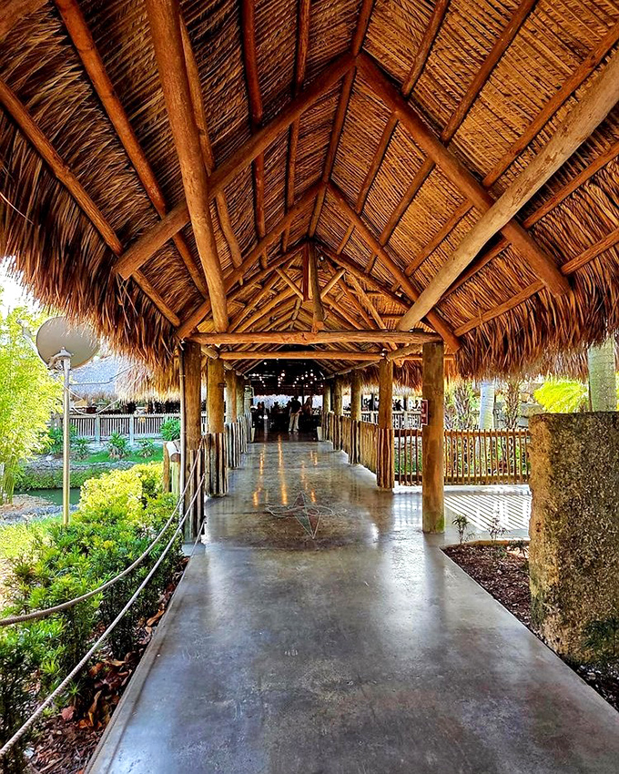 The stunning thatched-roof walkways guide visitors through the property, offering shade and style in equal measure.