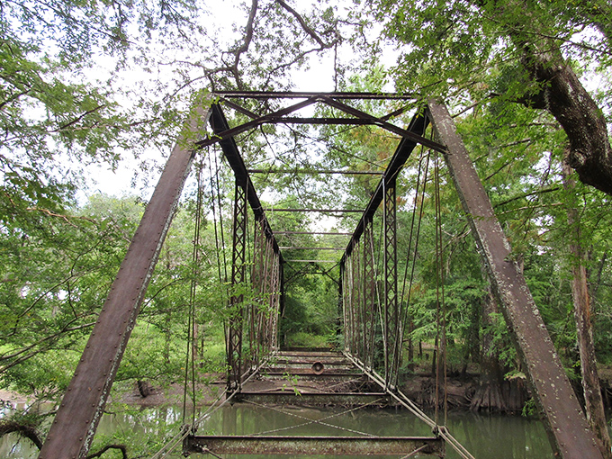 A ghostly passageway to nowhere, this century-old steel frame bridge whispers stories of those who once crossed.