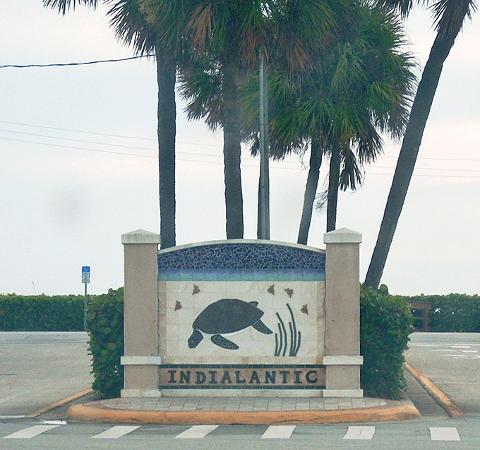 The town's entrance sign featuring a sea turtle mosaic &ndash; nature's official greeter and a reminder of the wildlife that calls these waters home.