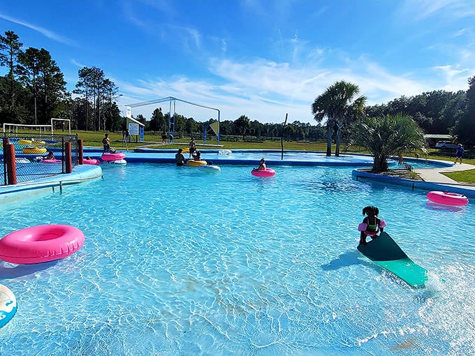 Summer bliss in liquid form. Colorful inner tubes dot the crystal-clear pool where memories are made one splash at a time.