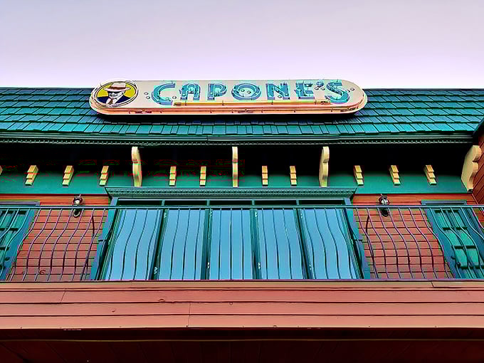 Step back in time at Capone's, where the rooftop sign glows with prohibition-era charm. This speakeasy dinner theater brings gangster history to delicious life.