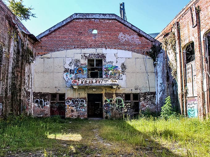 Nature's skylight installation wasn't exactly planned, but this roofless auditorium now hosts performances by birds and weather systems instead of nervous fifth-graders.