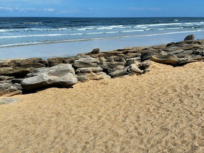 Where golden sands mingle with rugged rock formations, creating Florida's most distinctive shoreline experience.