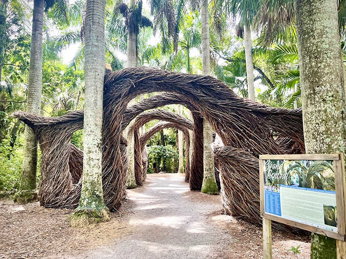 Woven branches create a natural archway that beckons visitors to venture deeper into the garden's mysteries. Nature's own welcome mat!