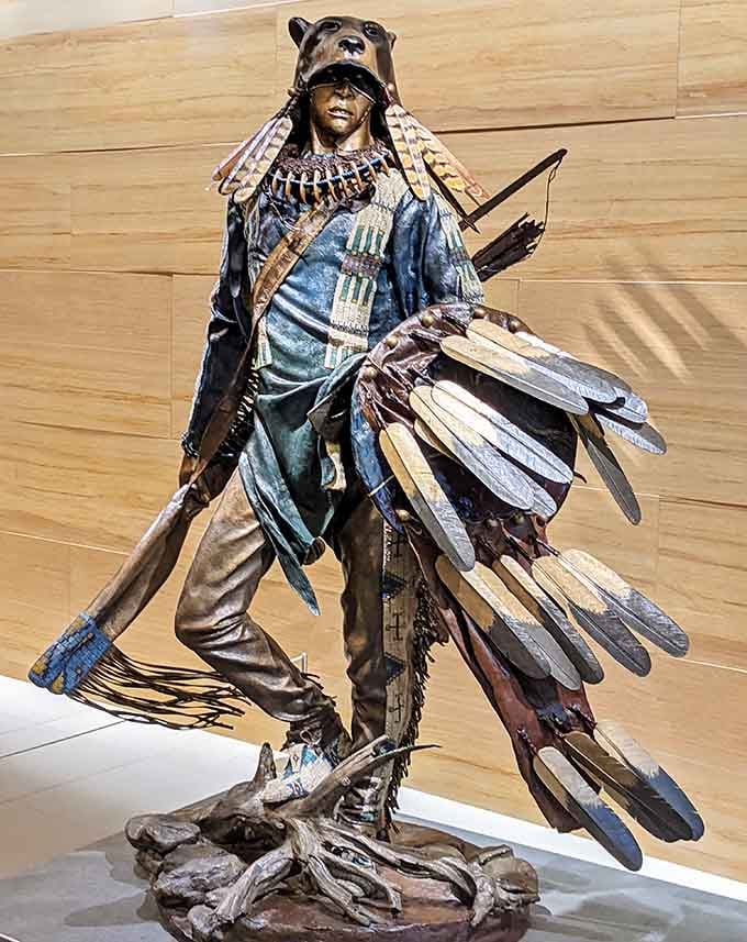 This dramatic figure combines indigenous tradition with wildlife symbolism, creating a powerful statement about humanity's connection to nature.