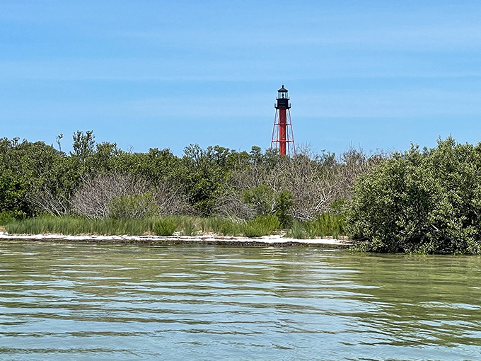 Lighthouse View from the Water: From the gentle Gulf waters, the lighthouse appears like a slender exclamation point on nature's perfect paragraph.