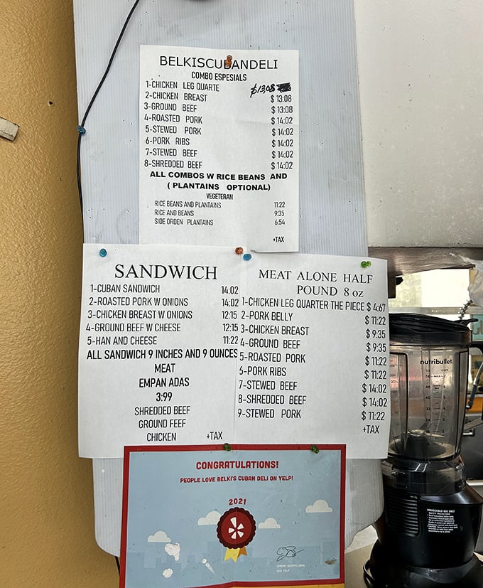 The no-frills menu board tells you everything you need to know – authentic Cuban classics at prices that won't break the bank.