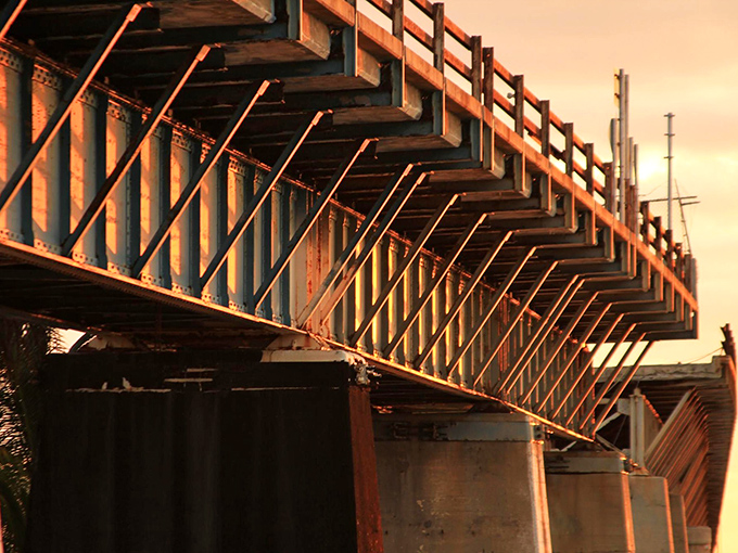 Golden hour transforms the weathered structure into a photographer's dream, painting century-old concrete with warm hues as day surrenders to dusk.