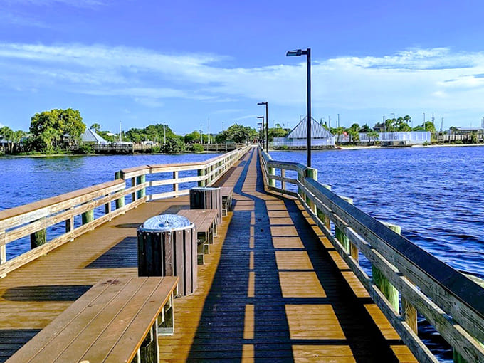 The boardwalk extends like a wooden welcome mat, inviting you to explore where land meets water.